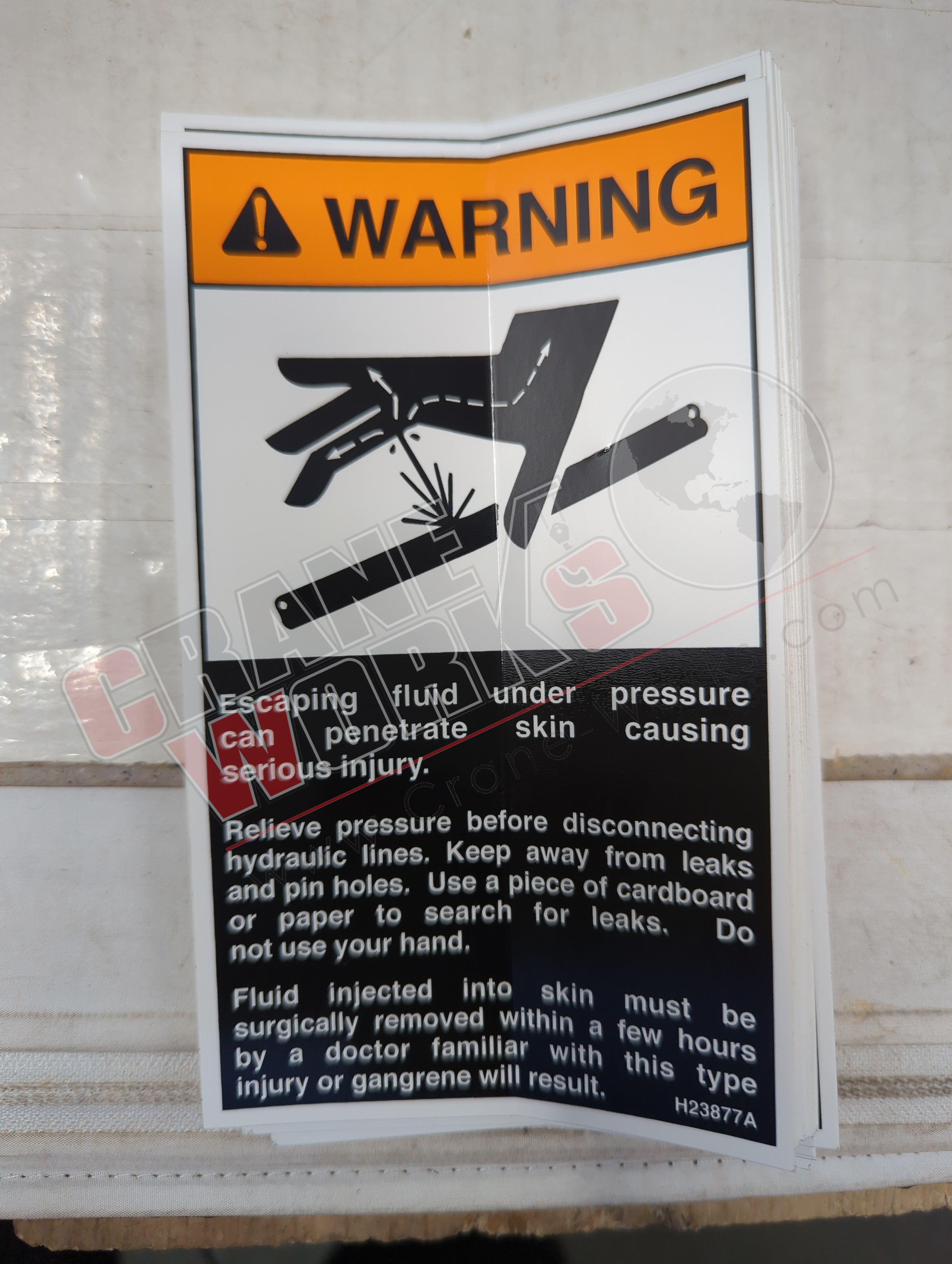 H23877TU | New Decal, Warning, Oil Leakage – CraneWorks